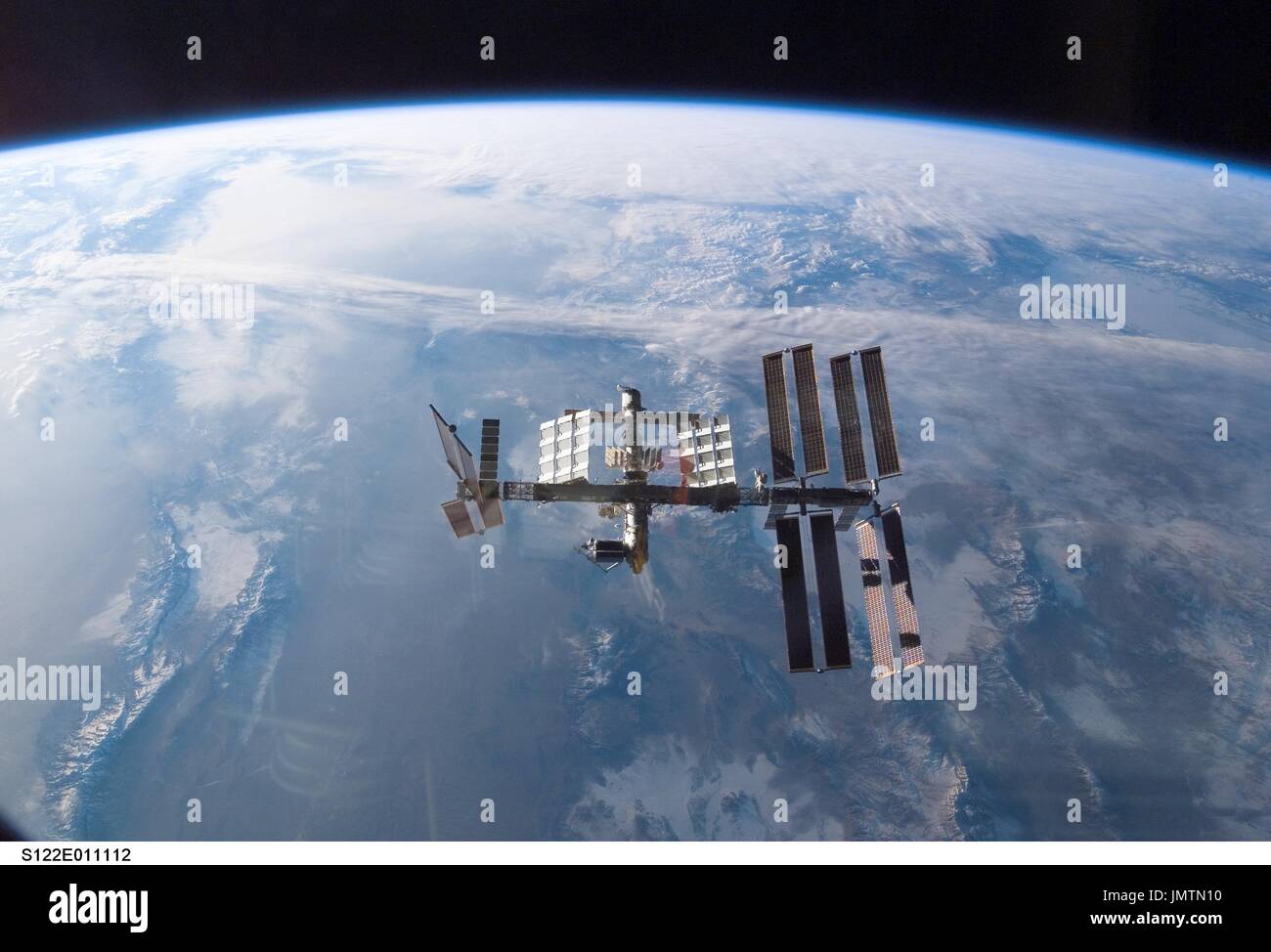 In Earth Orbit - February 18 2008 --- Backdropped by Earth's horizon ...