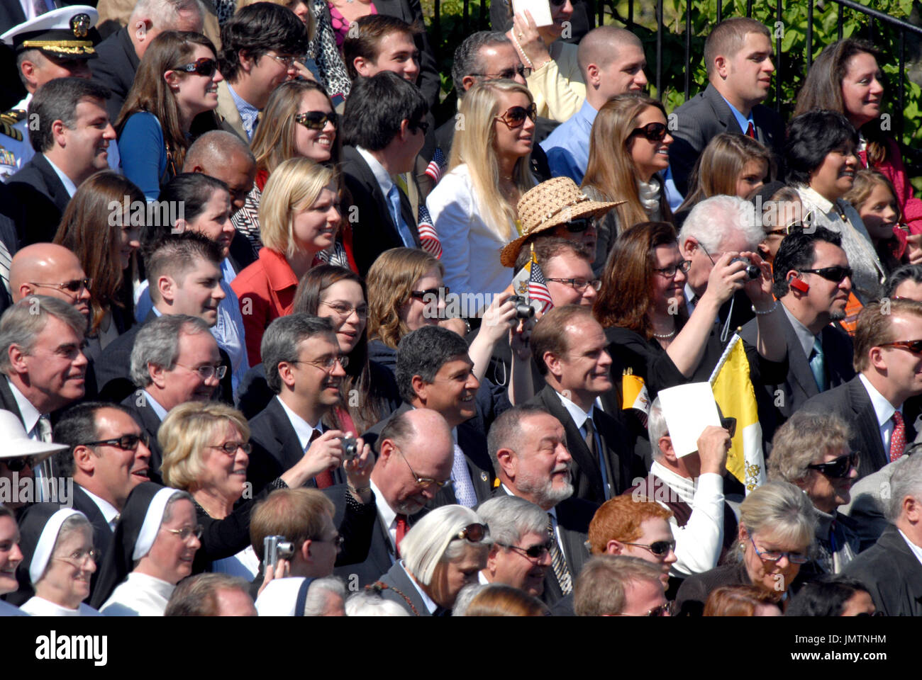 Washington, DC - April 15, 2008 -- Smiling people listen to the remarks ...
