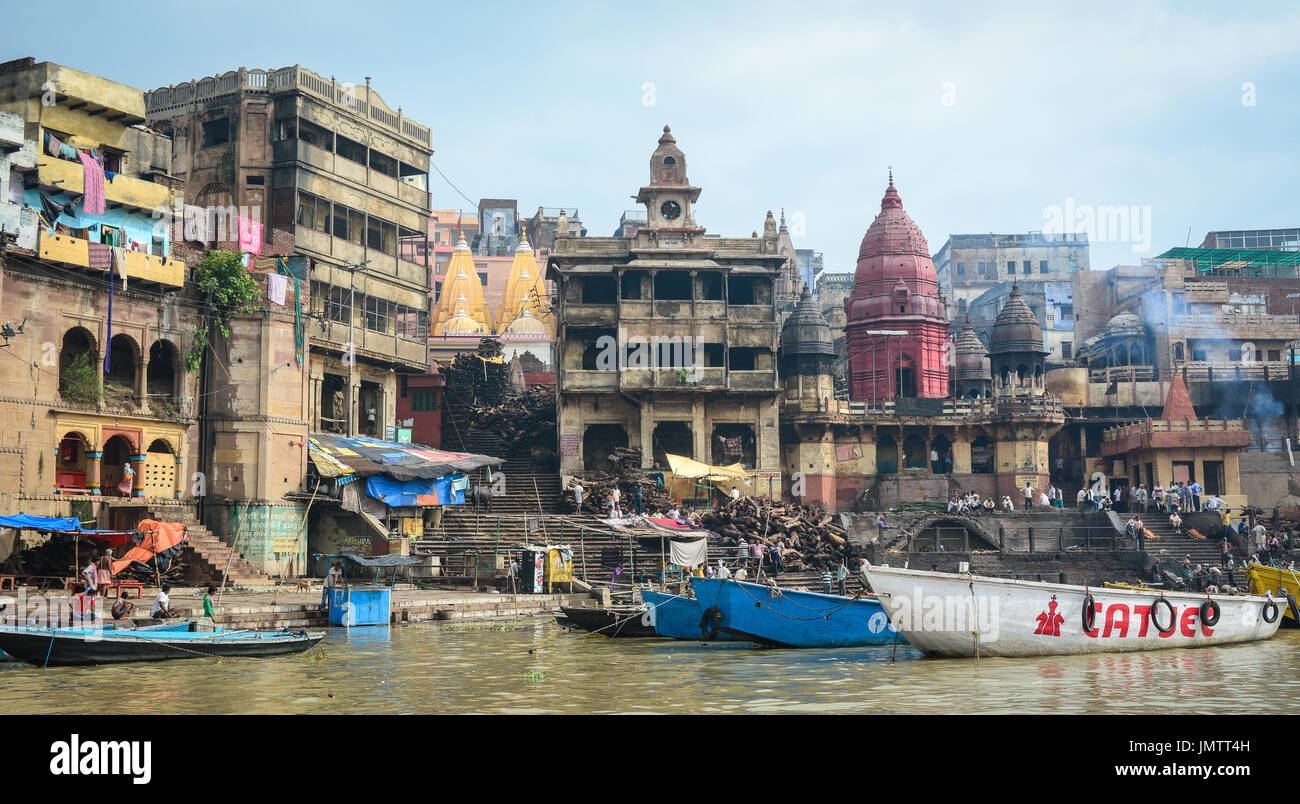 Varanasi, India - Jul 12, 2015. A group of people at the burning ghat ...