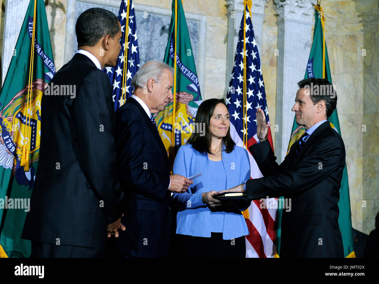 Timothy Geithner (R) is sworn in as treasury secretary by Vice ...