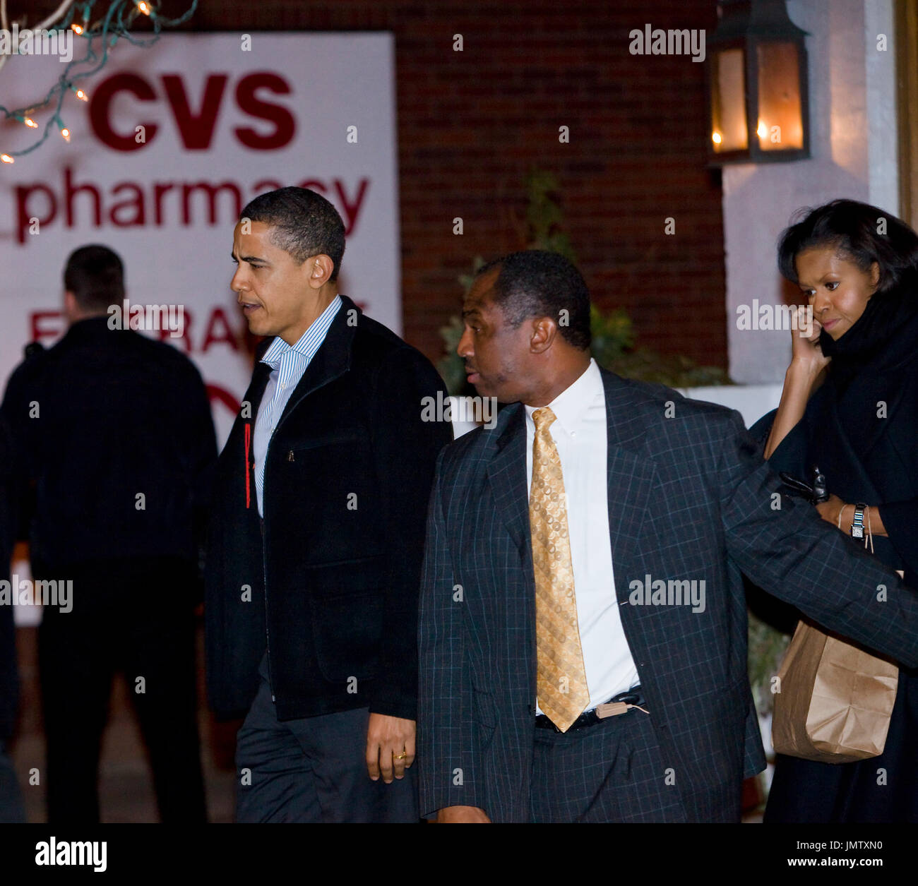 US President Barack Obama and his wife Michelle leave Table 52 ...