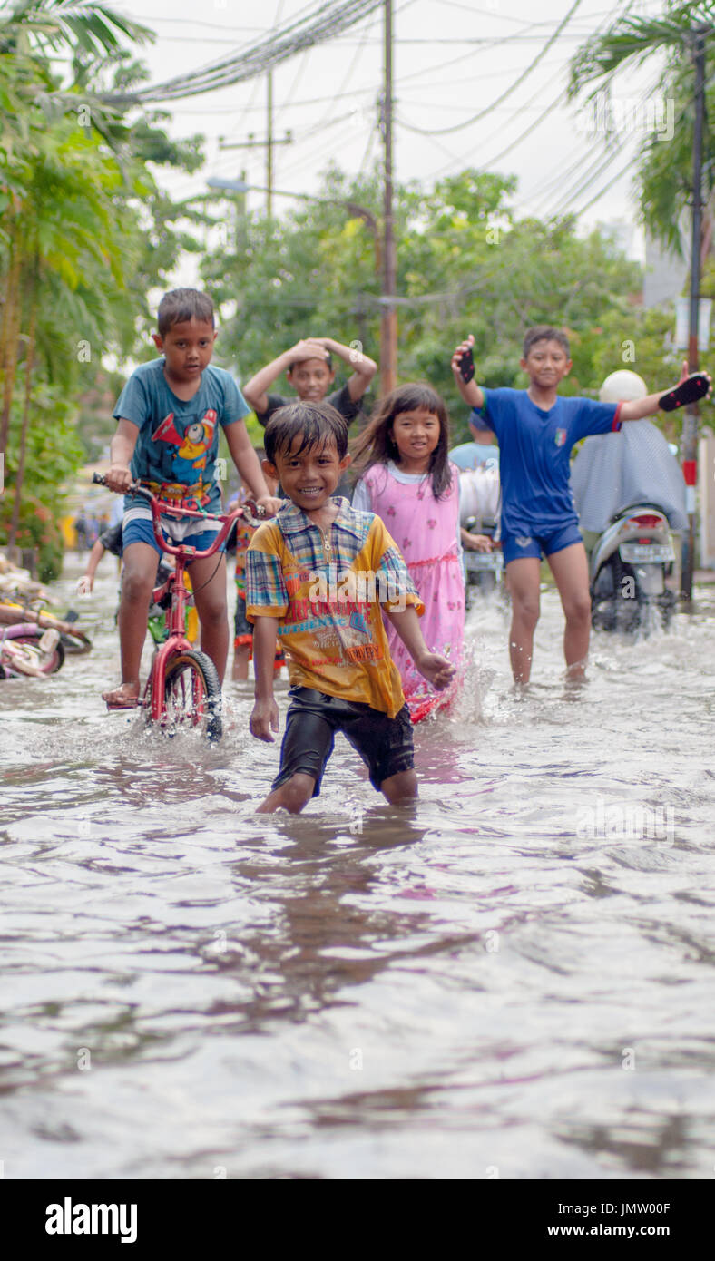 playing in the flood Stock Photo - Alamy