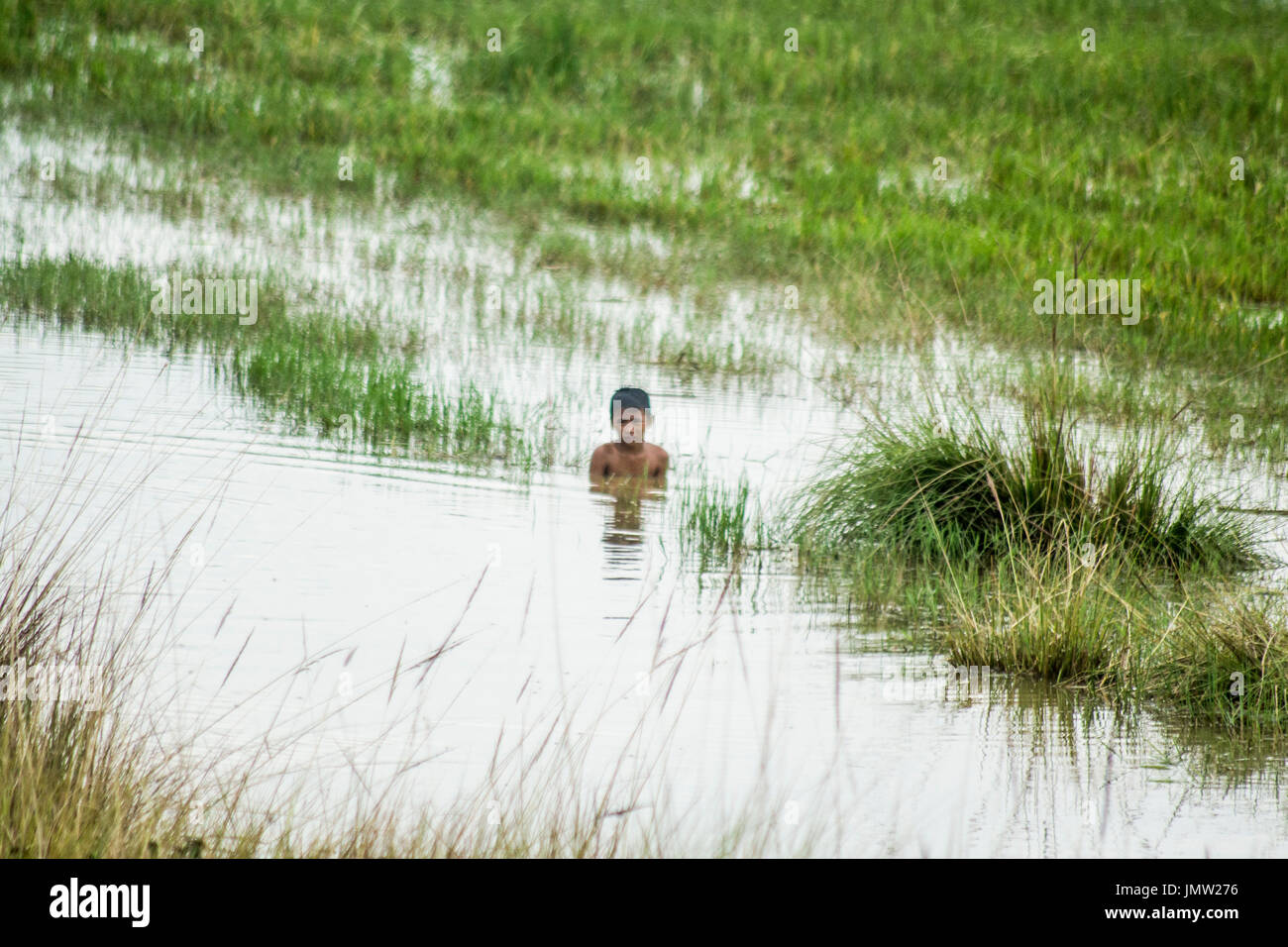 Boy in water Stock Photo - Alamy