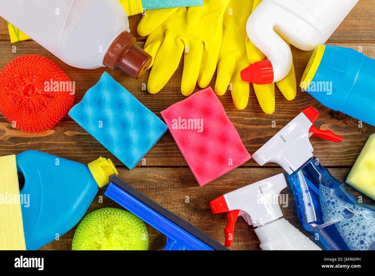 Top view studio shot of housekeeper's objects. There are bottles with ...