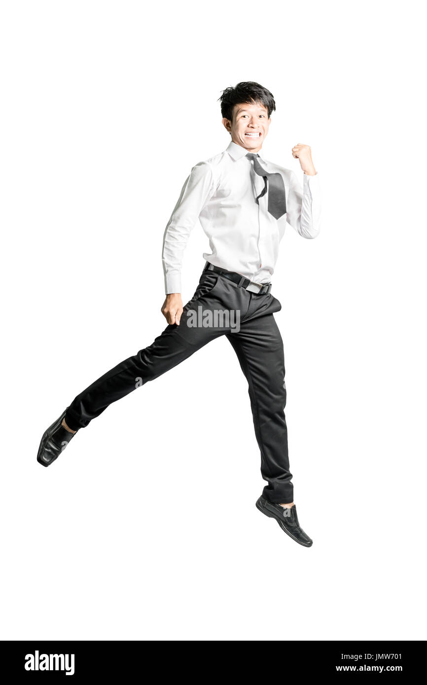 Portrait of a young asian businessman jumping and feeling glad ...