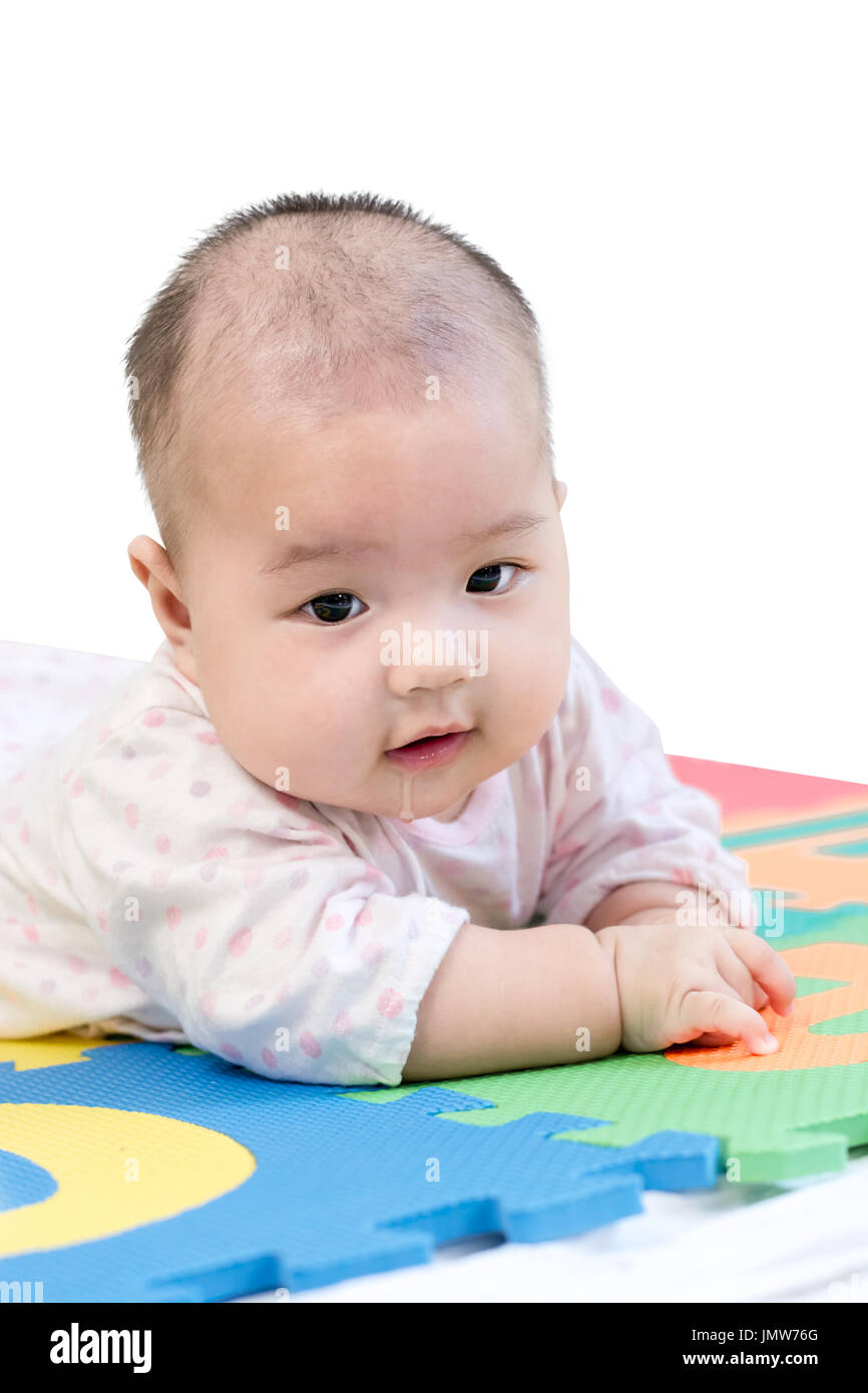 Portrait of a little adorable newborn infant baby girl with saliva ...