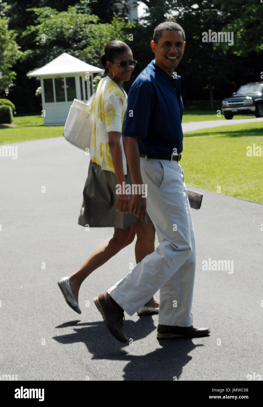 U.S. President Barack Obama and First Lady Michelle Obama walk out of ...
