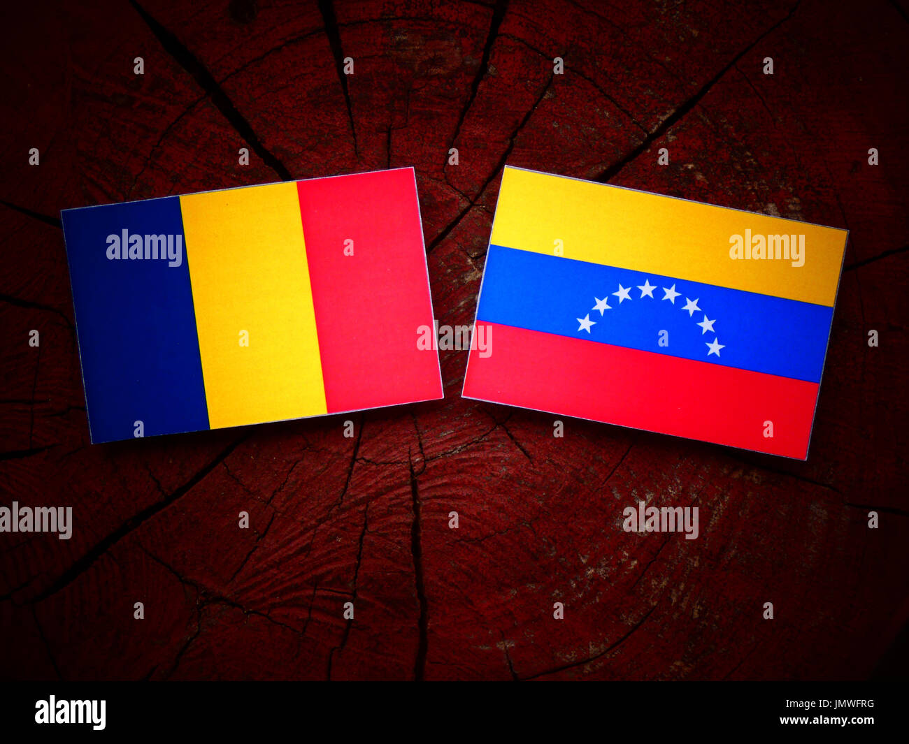 Chad flag with Venezuelan flag on a tree stump isolated Stock Photo - Alamy