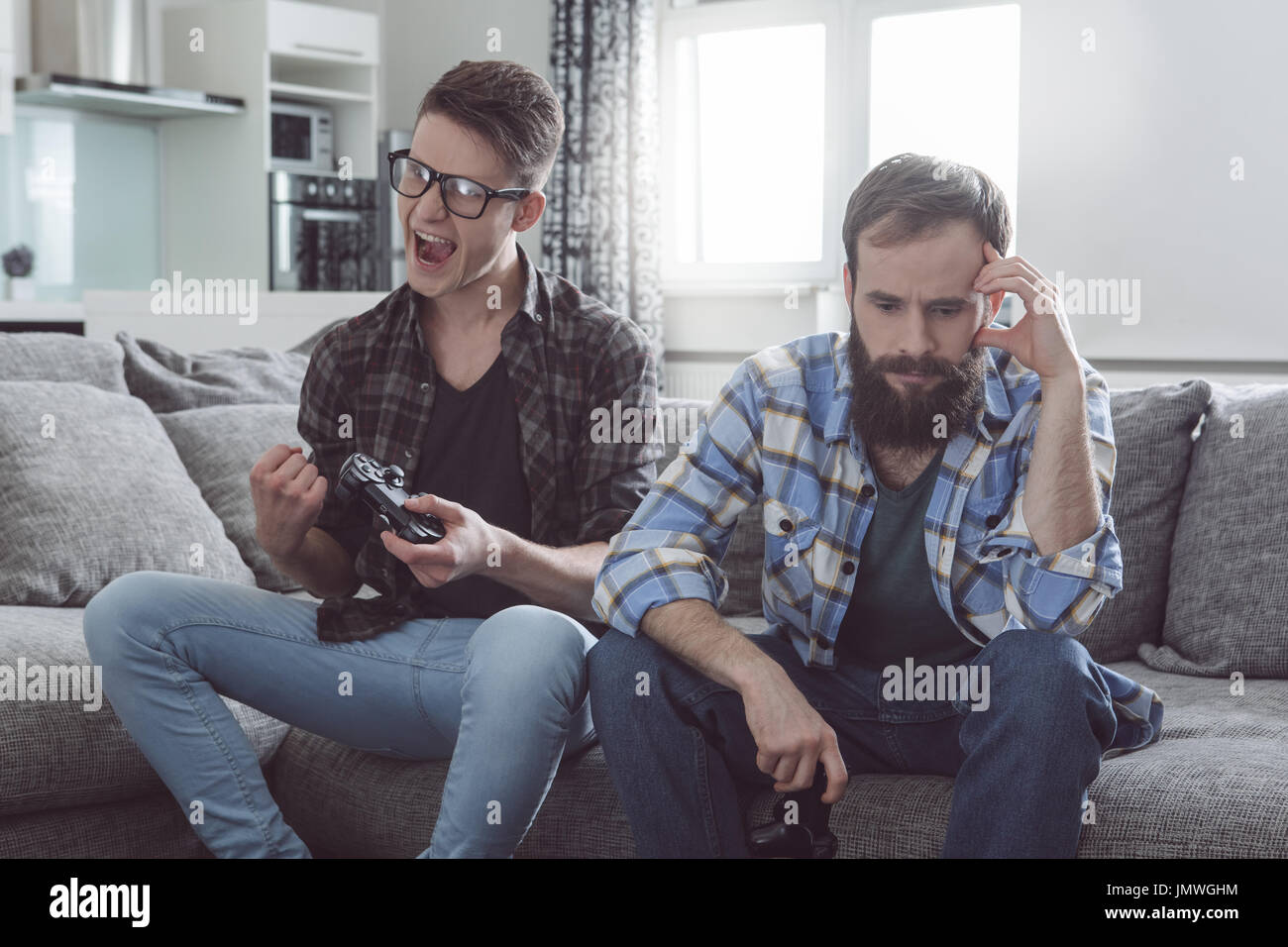 Friends having party together indoors playing video games Stock Photo ...