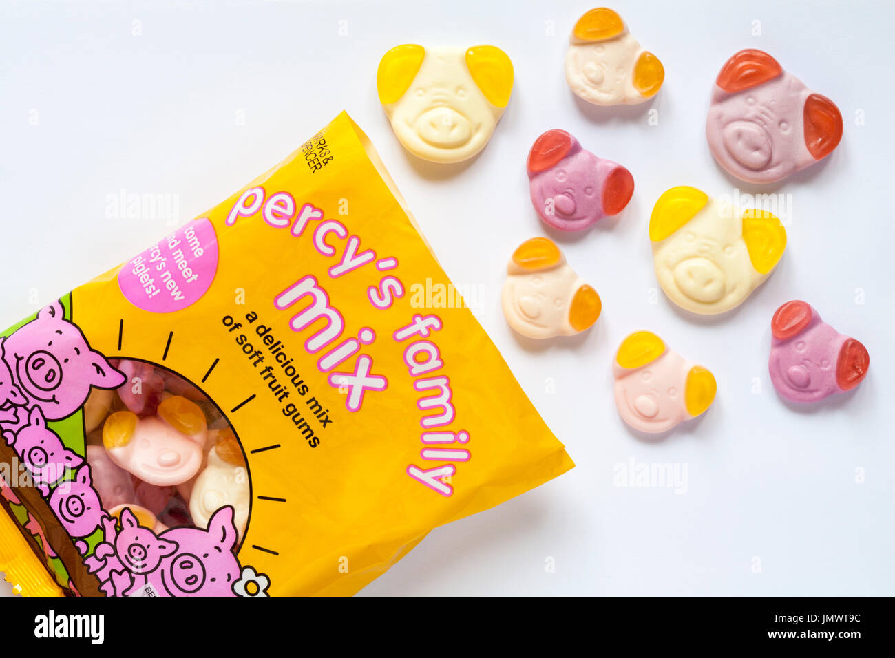 Bag of M&S percy's family mix percy pig sweets opened to show contents set on white background ...