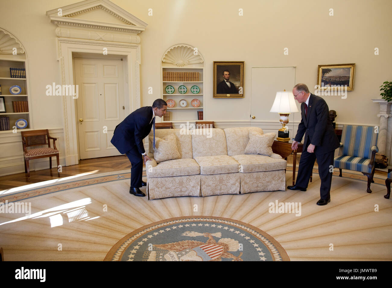 President Barack Obama is helped by Vermont Governor Jim Douglas to ...