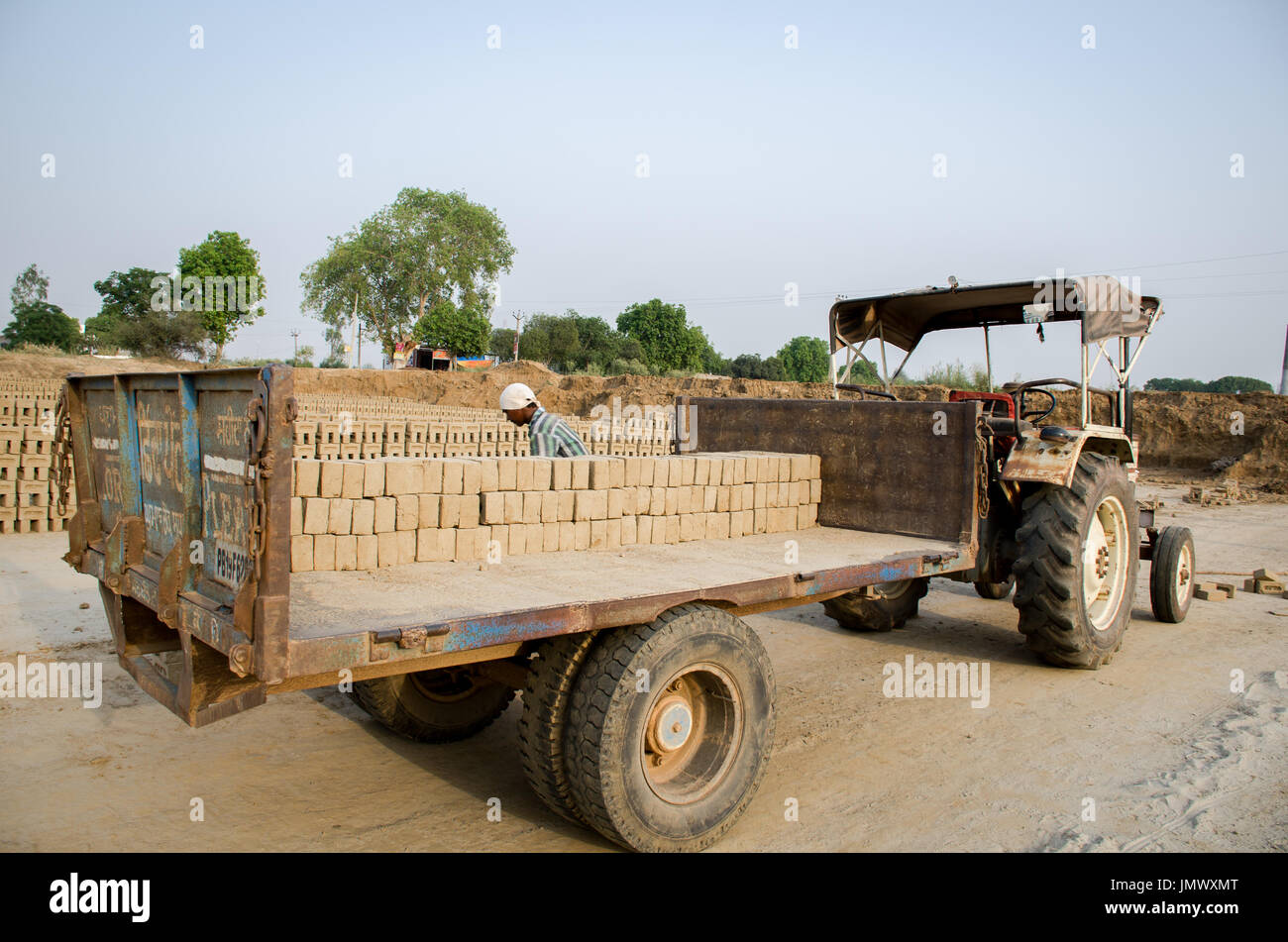 AMRITSAR, PUNJAB, INDIA - 21 APRIL 2017 : bricks being loaded on a ...