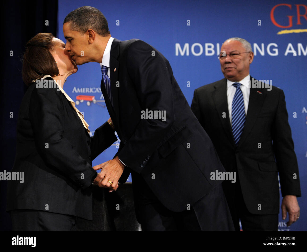 United States President Barack Obama, center, kisses Alma Powell, wife ...