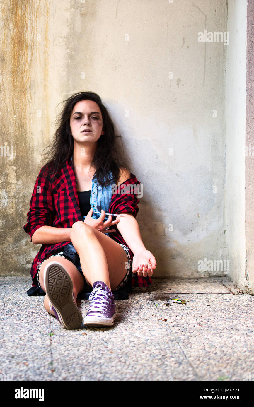 Drug-addicted girl who is crying with heroin syringe Stock Photo - Alamy