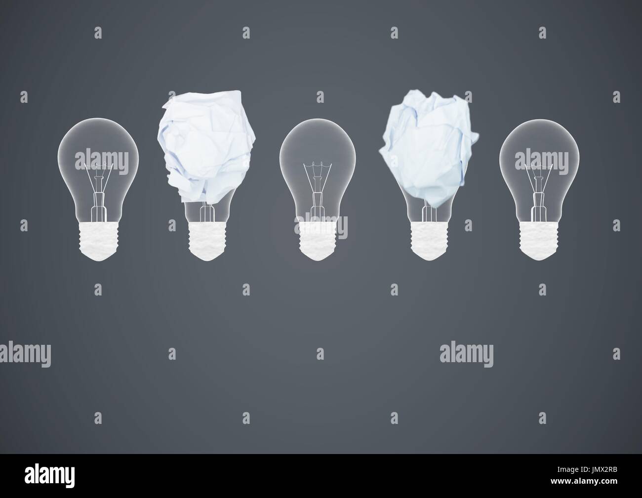 Digital composite of light bulbs with crumpled paper balls in front of ...