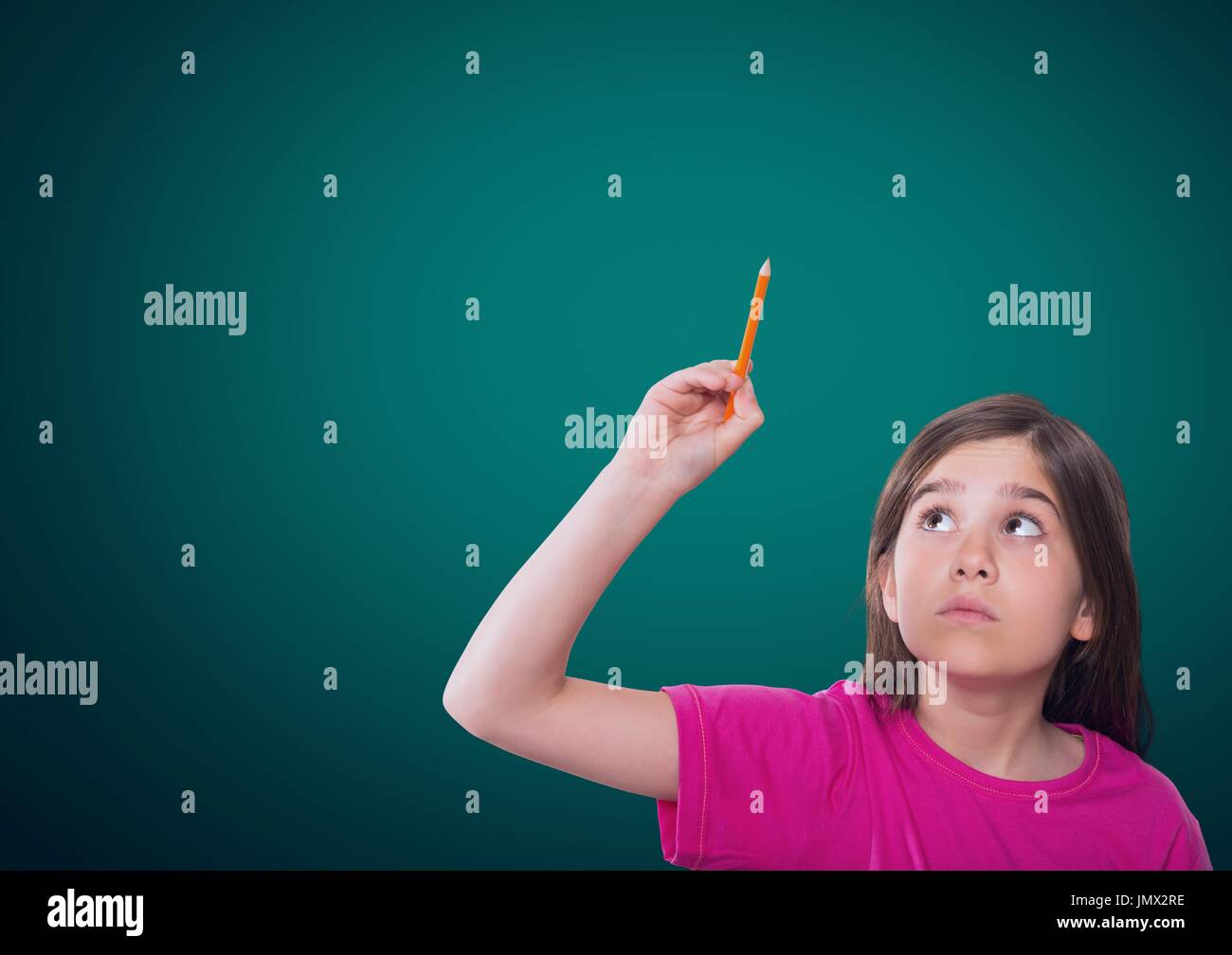 Digital composite of Girl writing in front of green blank background ...