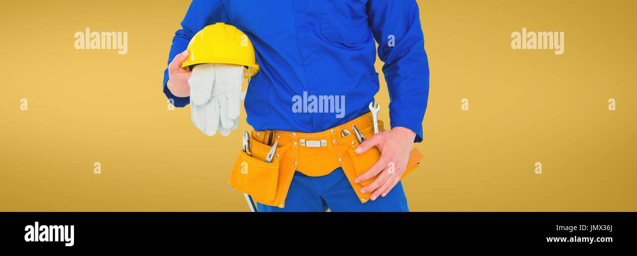 Digital composite of Plumber man holding globes and a helmet against ...