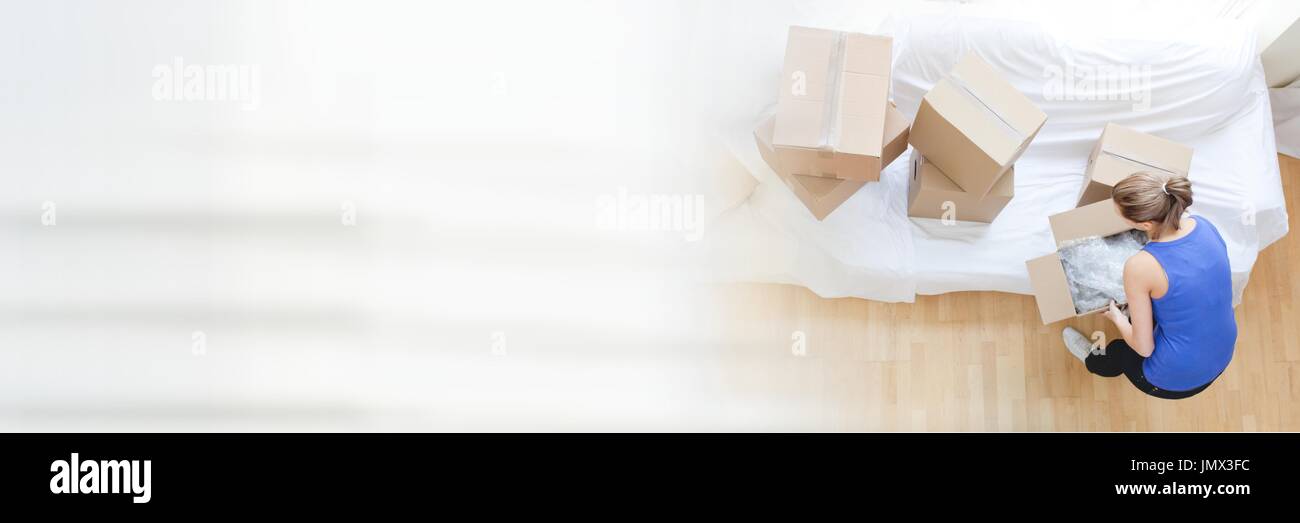 Digital composite of Woman moving boxes in her new house Stock Photo ...