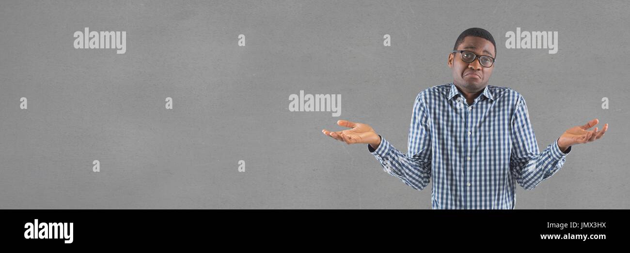 Digital composite of Confused man standing against wide blank grey ...