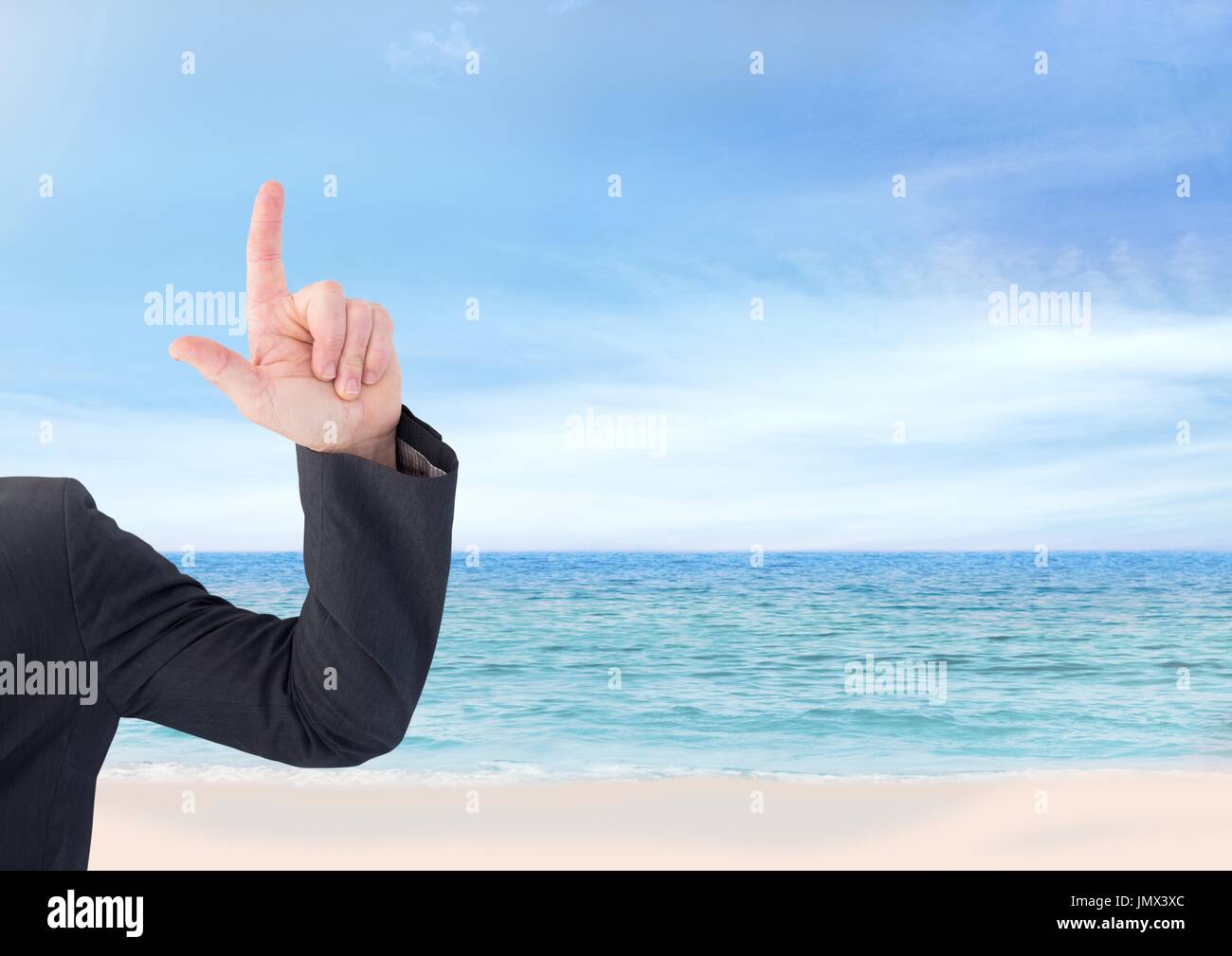 Digital composite of Arm pointing up at beach Stock Photo - Alamy