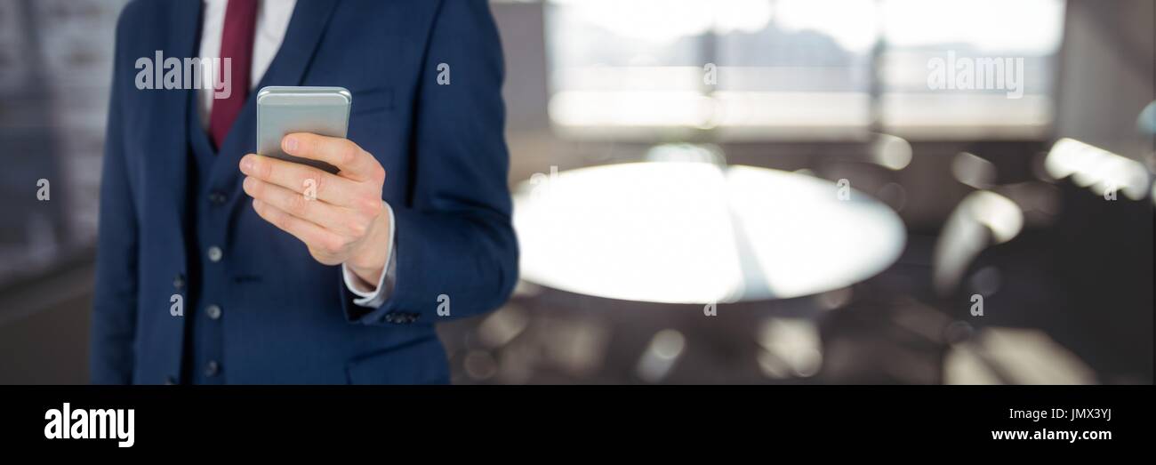 Digital composite of Business man using a phone against office ...