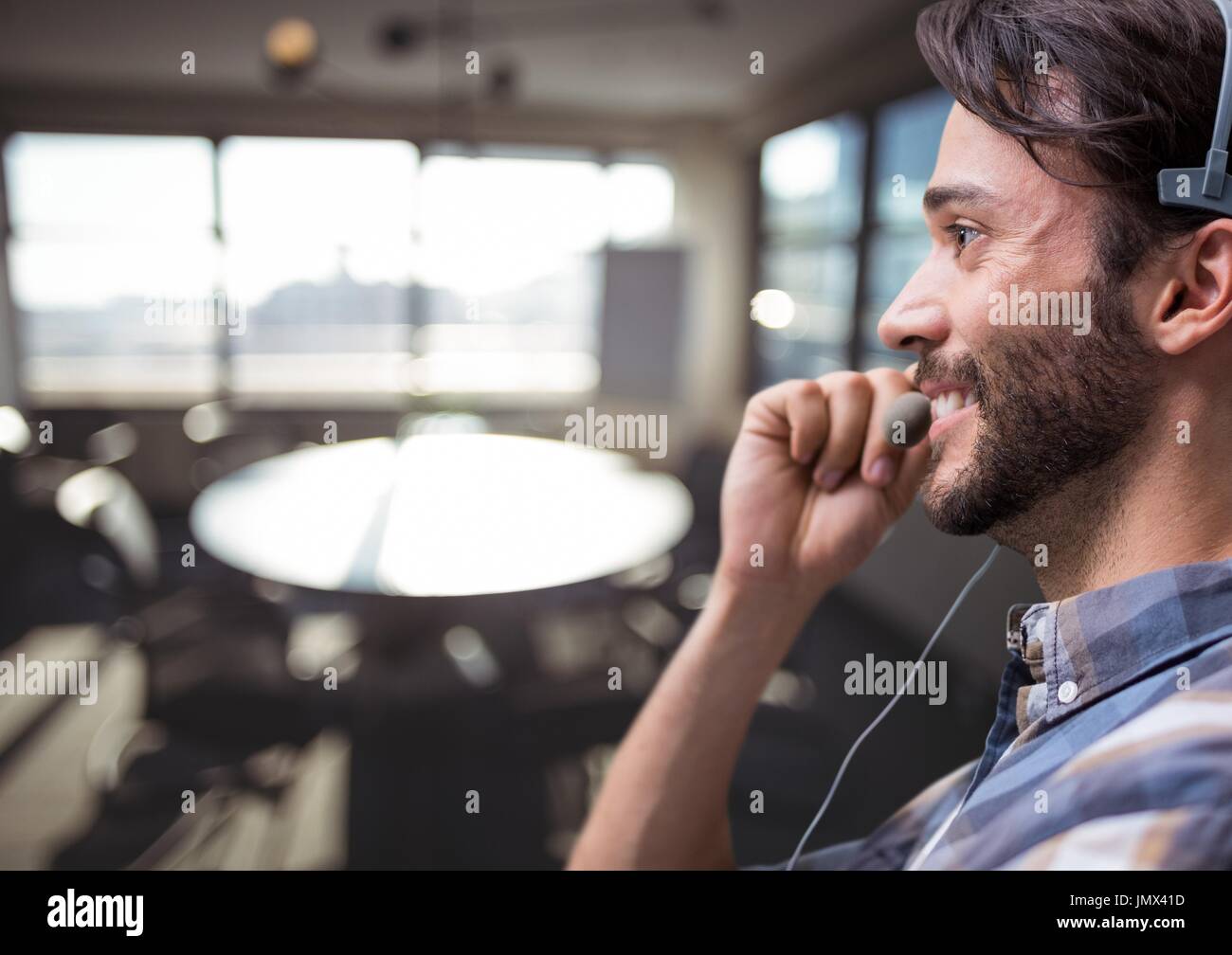Digital composite of Happy customer care representative man against ...