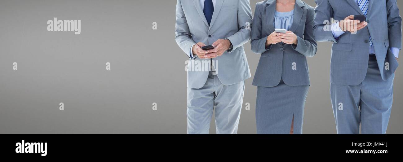 Digital composite of Business people using phones against grey ...