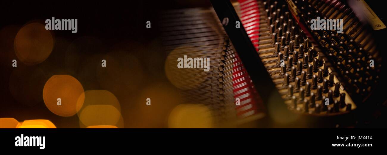 Digital composite of Interior of a piano with yellow lights Stock Photo ...