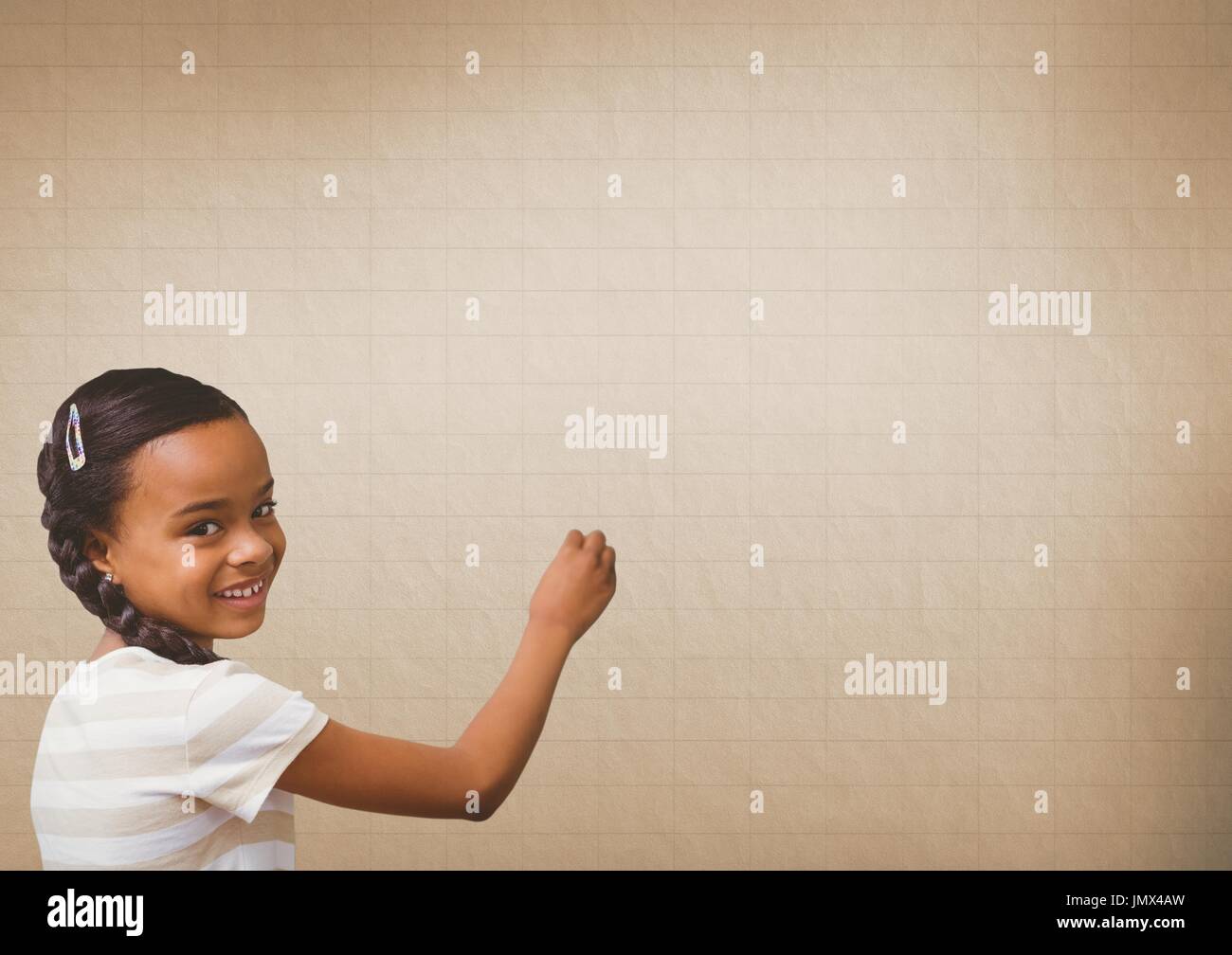 Digital composite of Girl writing in front of brown blank background ...