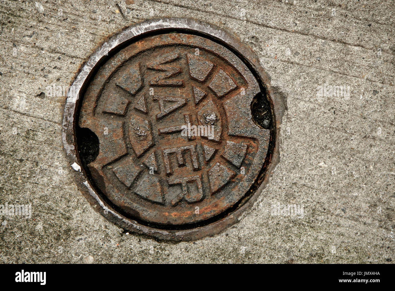 A water main manhole cover Stock Photo - Alamy