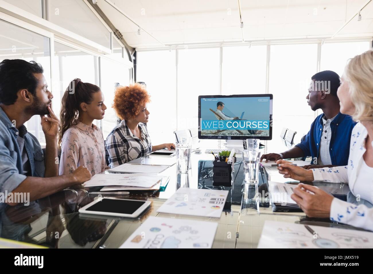 Digital composite of People looking at a computer with e-learning ...
