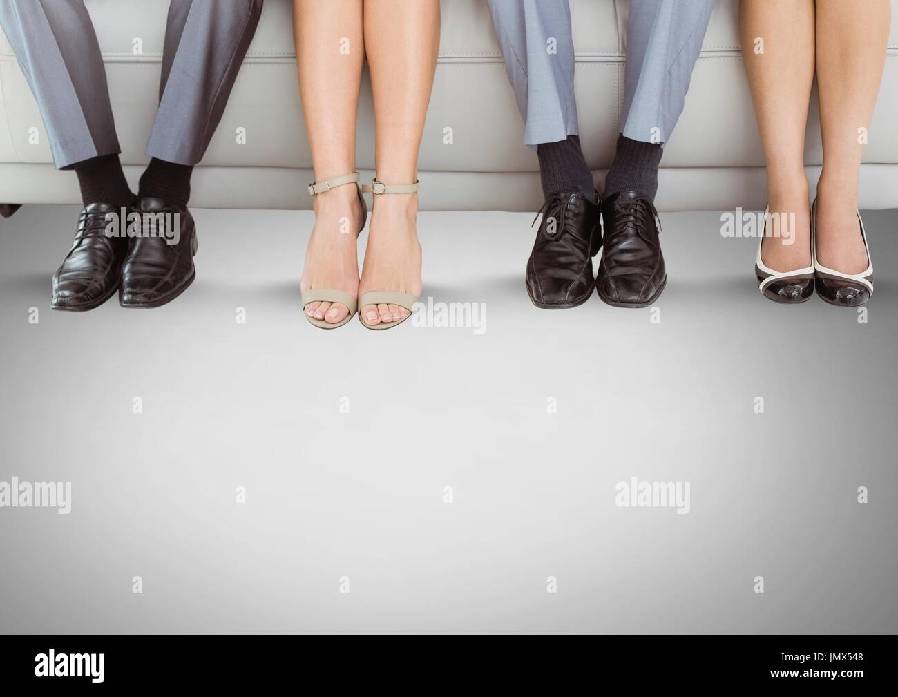 Digital composite of People legs and feet on couch Stock Photo - Alamy