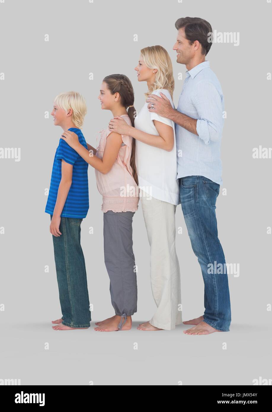 Digital composite of Full body portrait of family standing together ...