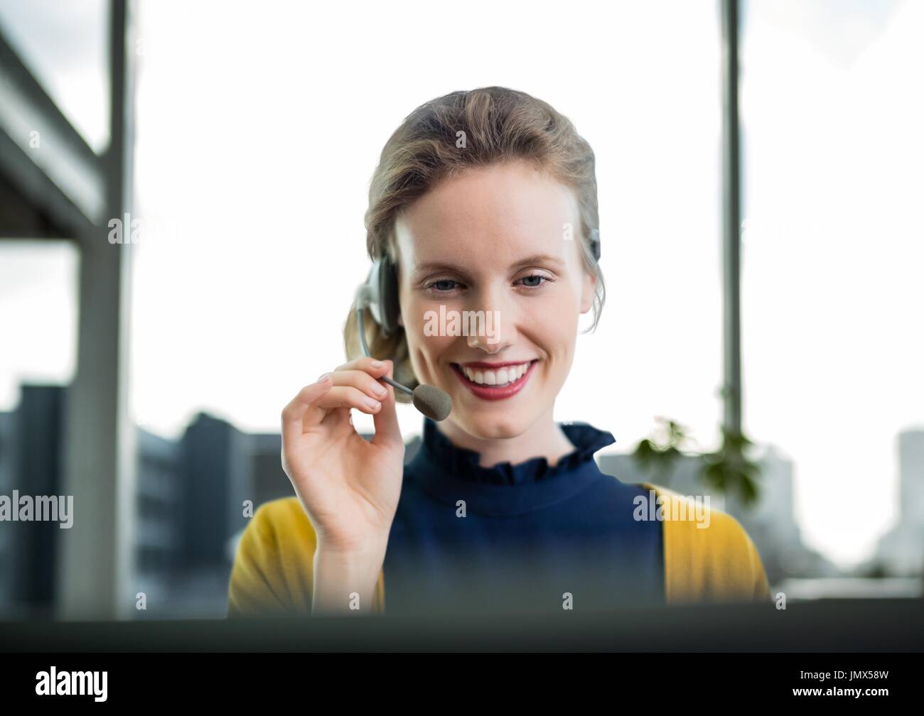 Digital composite of Happy customer care representative woman against ...