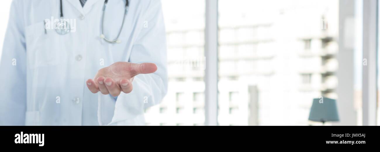 Digital composite of Doctor showing hand face up Stock Photo - Alamy