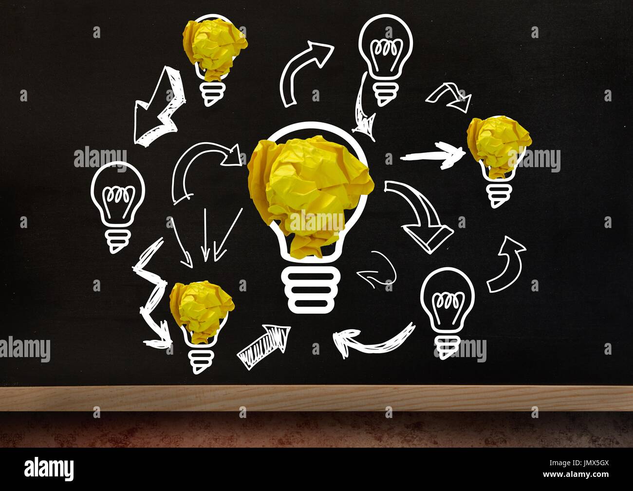 Digital composite of light bulbs with crumpled paper balls in front of ...