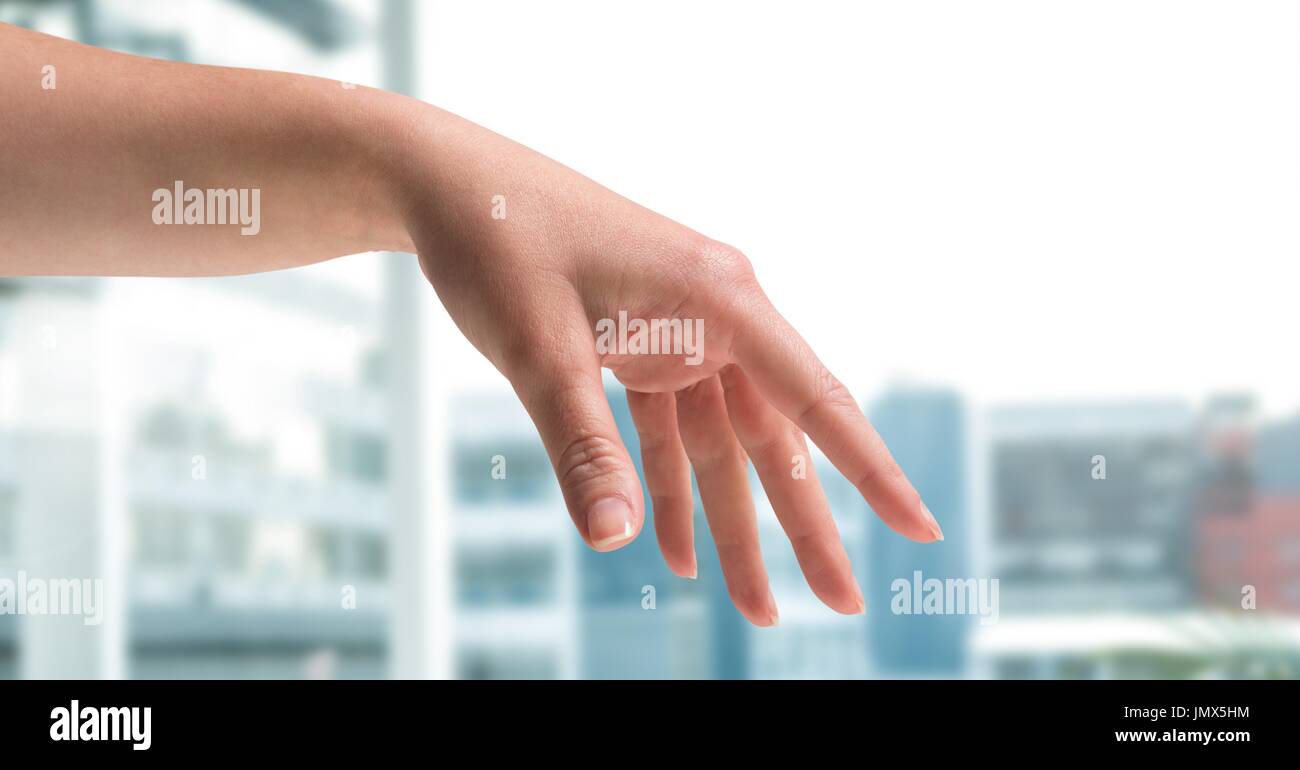Digital composite of Expressive Hand posing with city background blur ...
