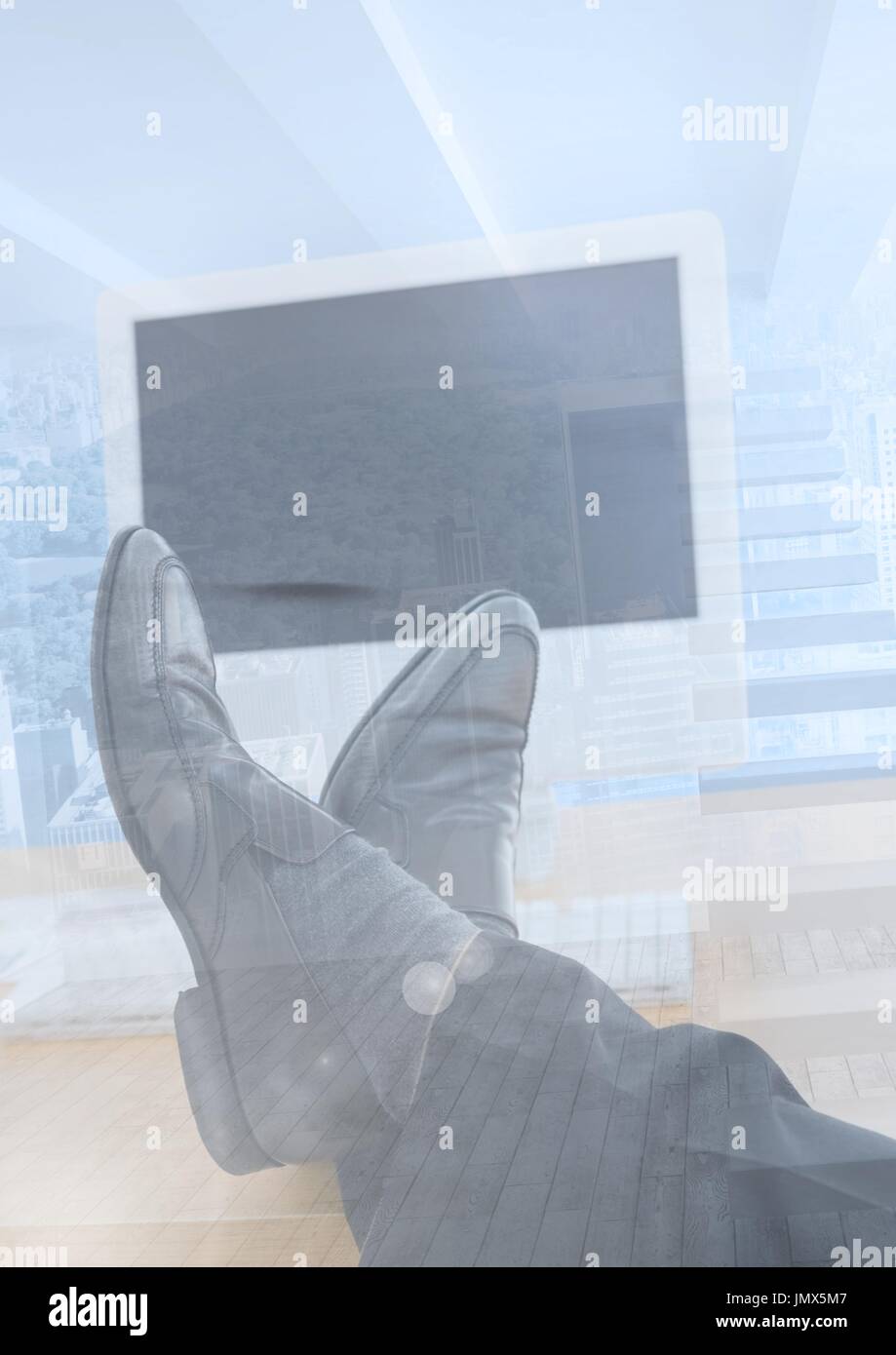 Digital composite of Legs relaxing on desk in office Stock Photo - Alamy