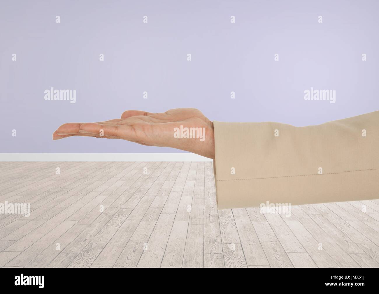 Digital composite of Hand reached out in room Stock Photo - Alamy