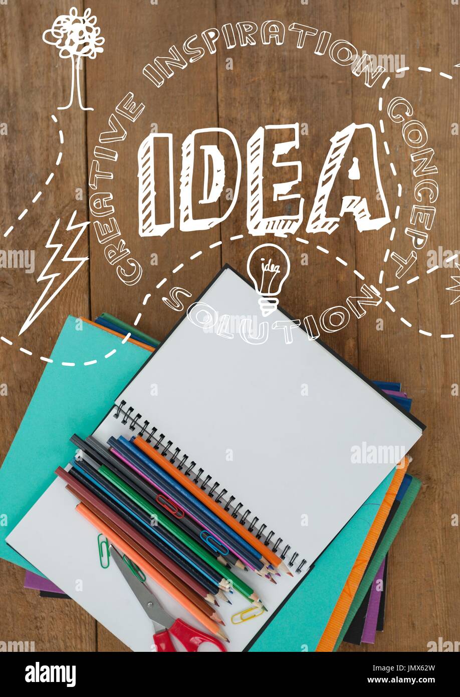 Digital composite of Idea graphics text written on table with notebook ...