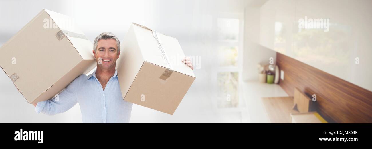 Digital composite of Happy man moving boxes in his new house Stock ...