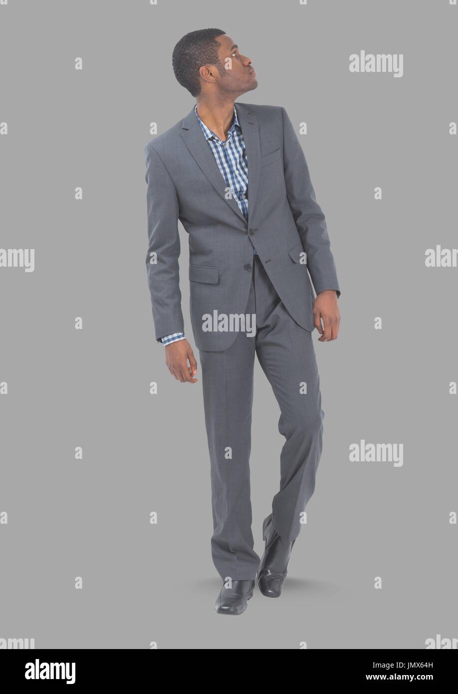 Digital composite of Full body portrait of man standing with grey ...