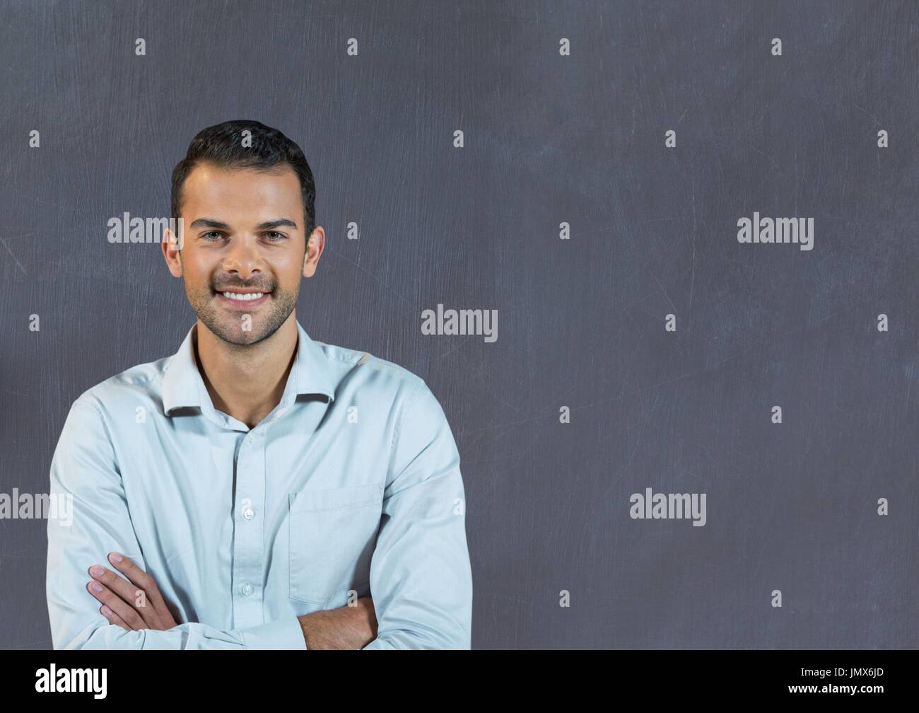 Digital composite of man standing with blackboard Stock Photo - Alamy
