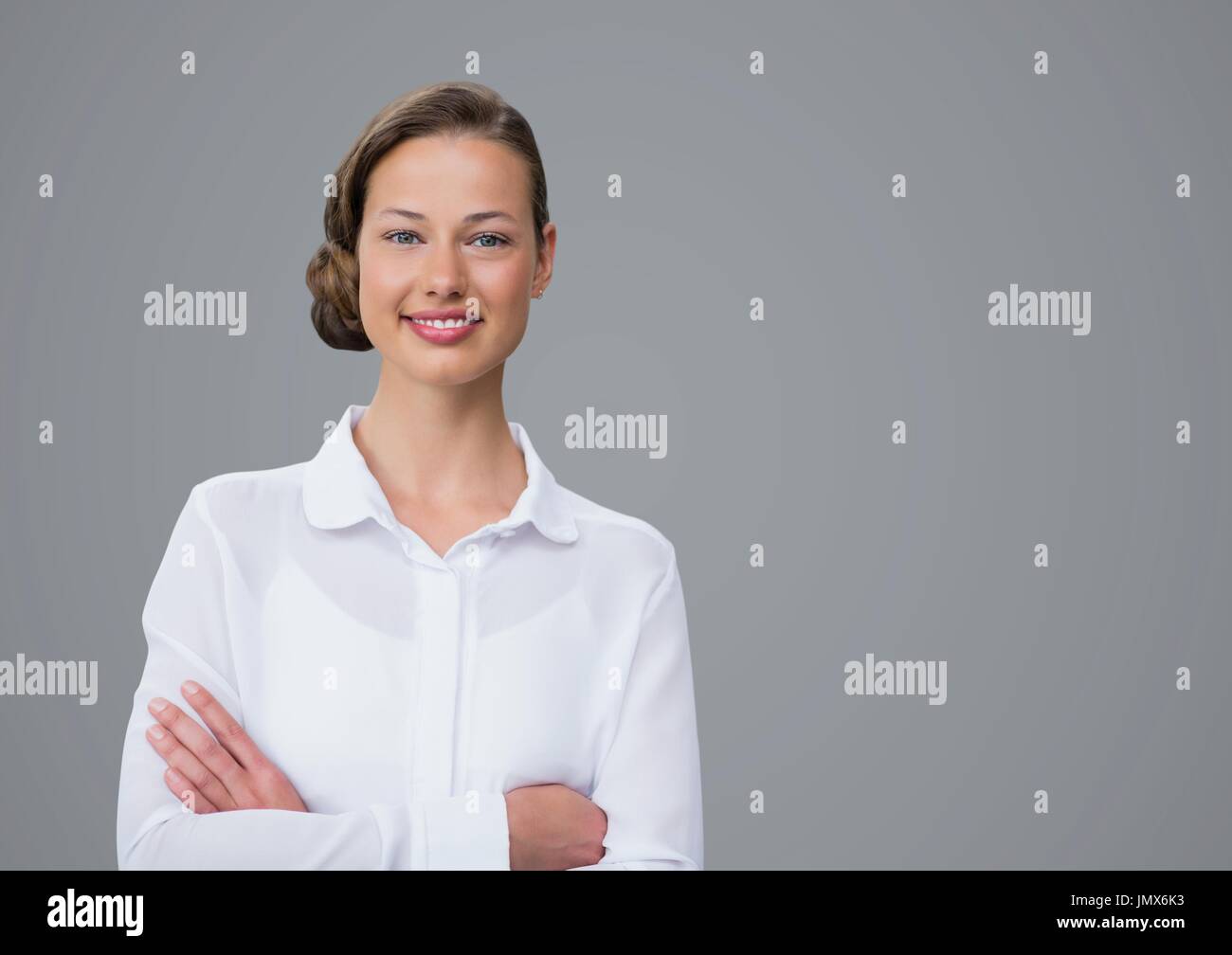 Digital composite of Woman standing with grey background Stock Photo ...
