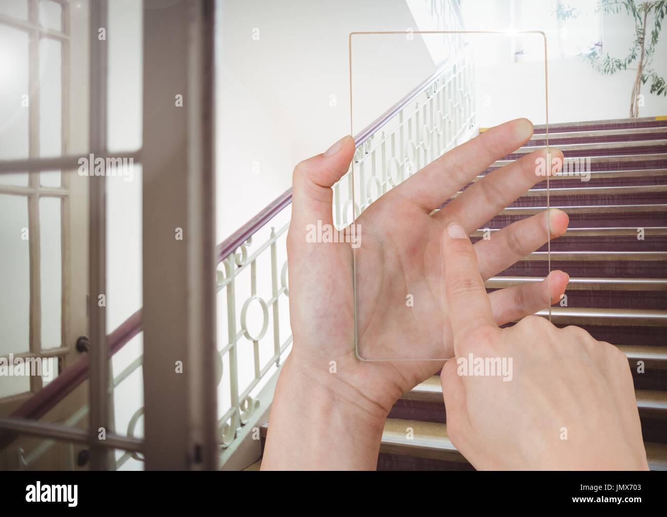 Digital composite of Hand Touching Glass Screen on stairs Stock Photo ...