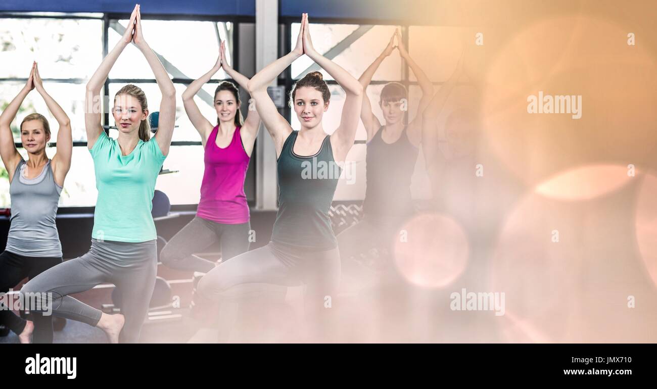 Digital composite of Women doing yoga and peach bokeh transition Stock ...