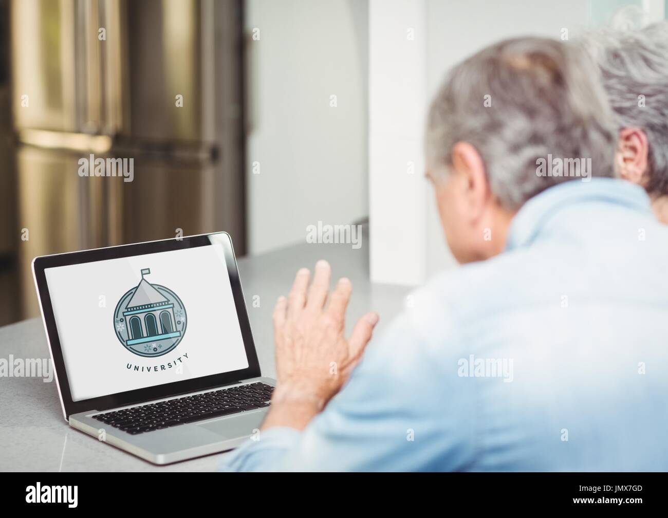 Digital composite of People looking at a computer with education icon ...