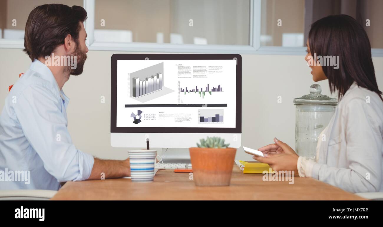 Digital composite of Business people having discussion over graphs on ...