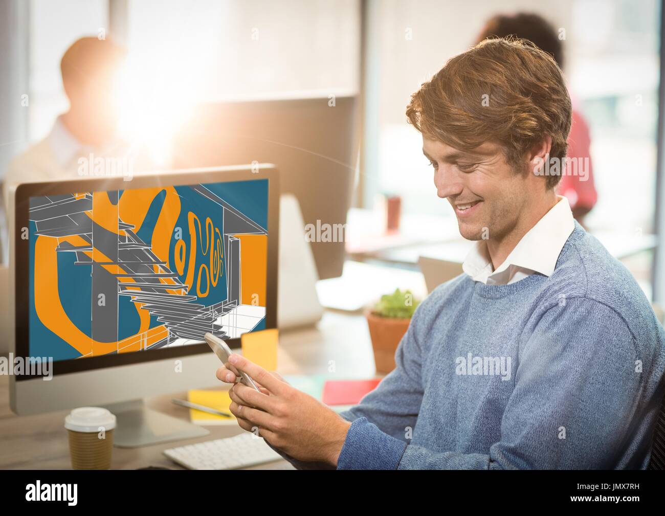 Digital composite of young happy businessman with phone in front of the ...