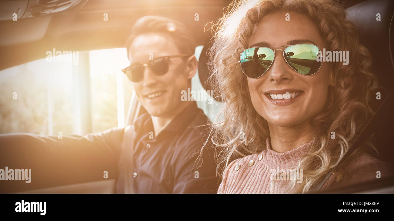 Portrait of smiling couple doing test drive in car Stock Photo - Alamy